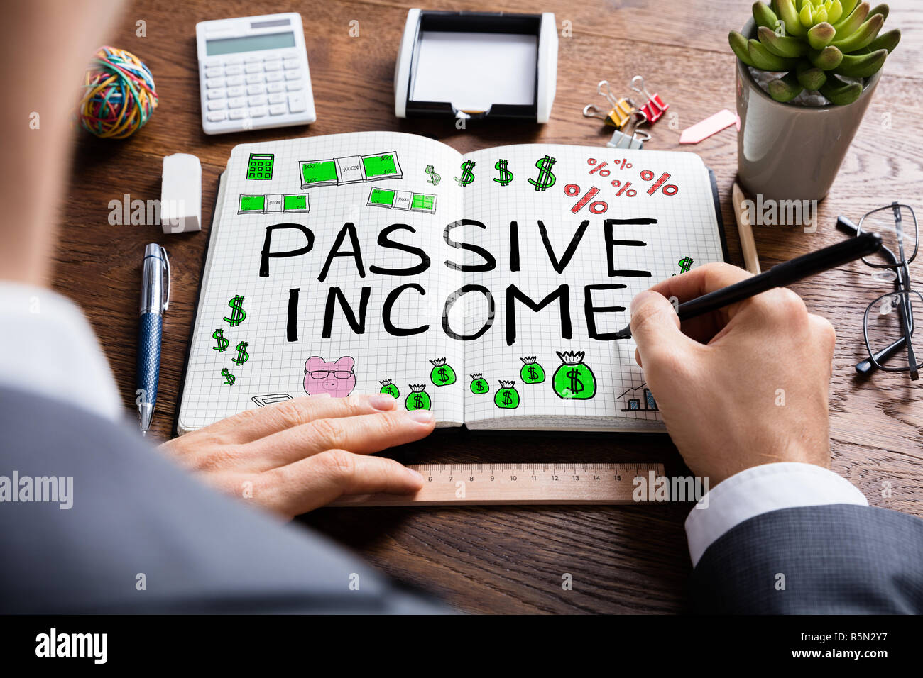Man Drawing Passive Income Concept Stock Photo - Alamy