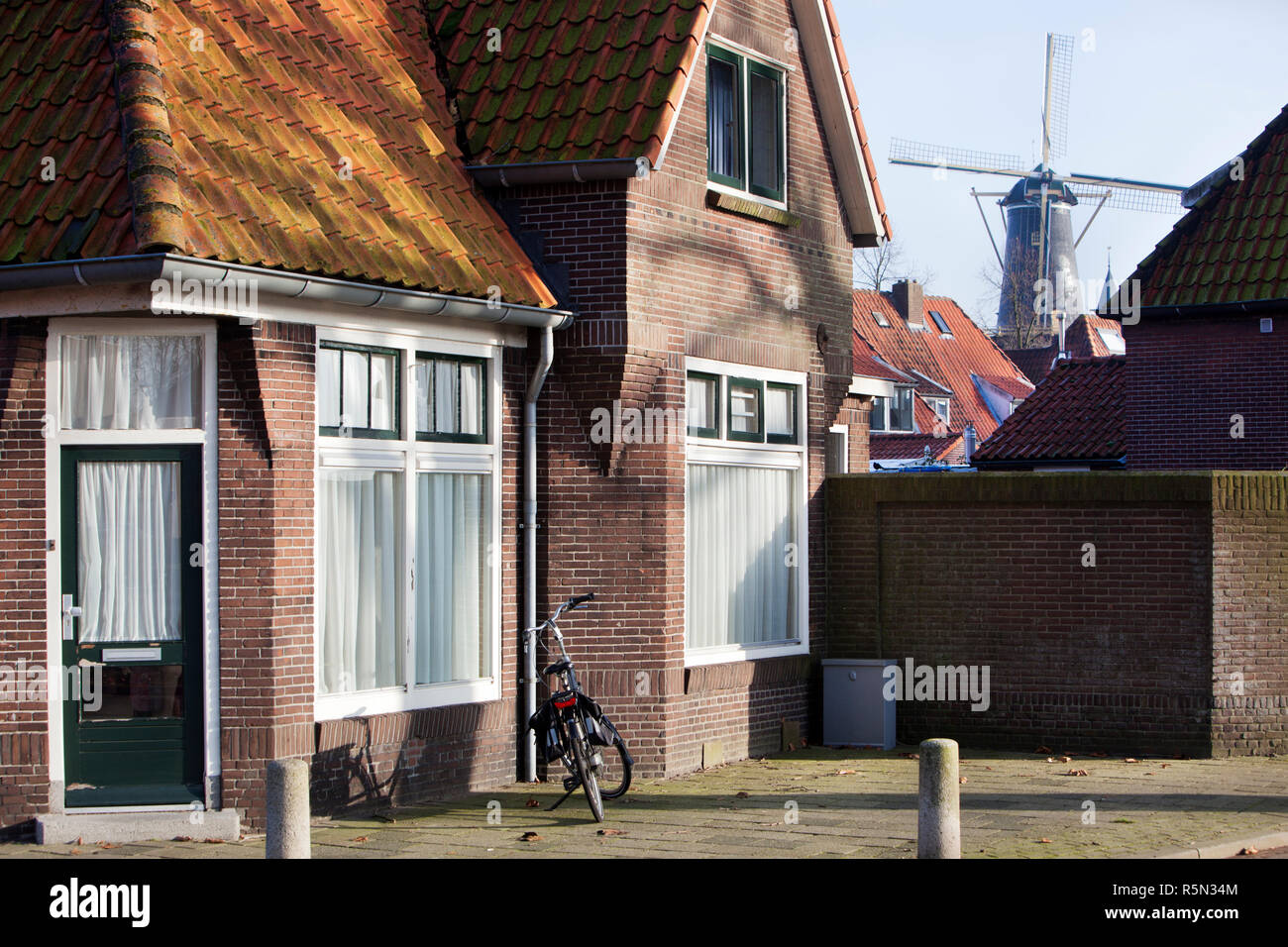 Traditional Dutch houses and a windmill Stock Photo - Alamy