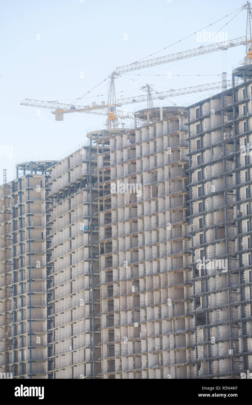 Cranes building a block Stock Photo - Alamy