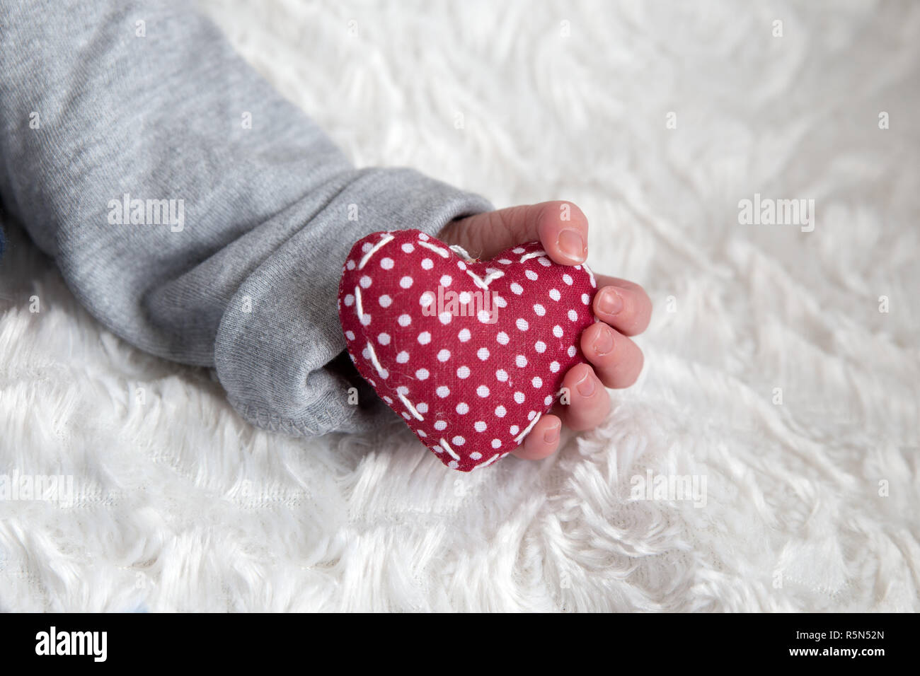 baby hand with heart Stock Photo - Alamy