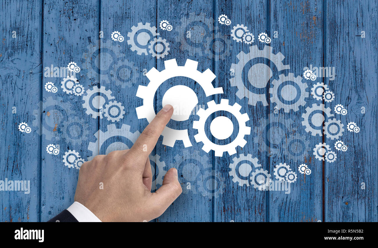 hand points to cog wheel cloud concept Stock Photo - Alamy