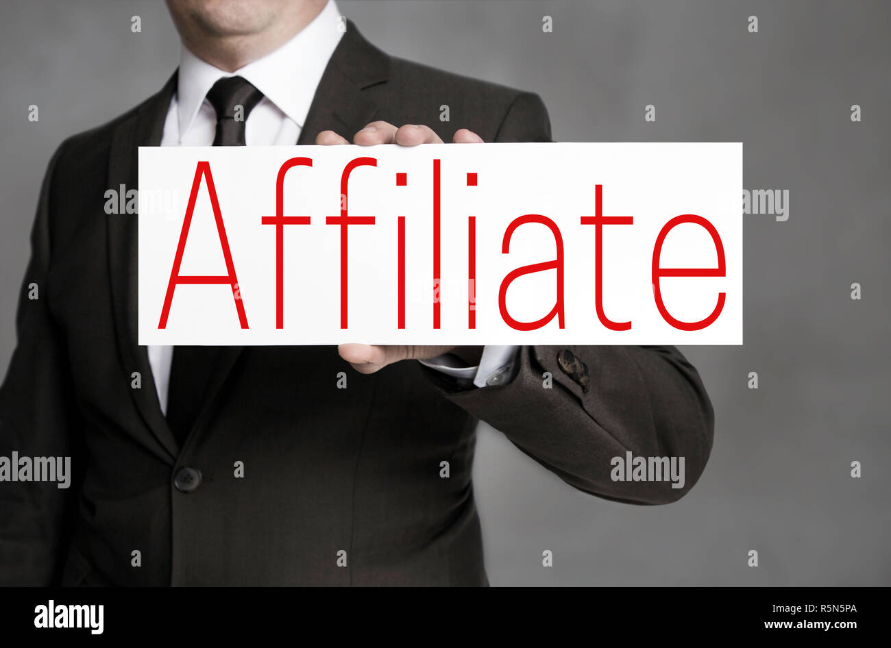 affiliate sign is held by businessman Stock Photo - Alamy