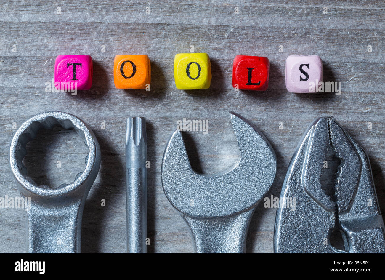 tools letter cube and tool on gray wood. visualization Stock Photo - Alamy