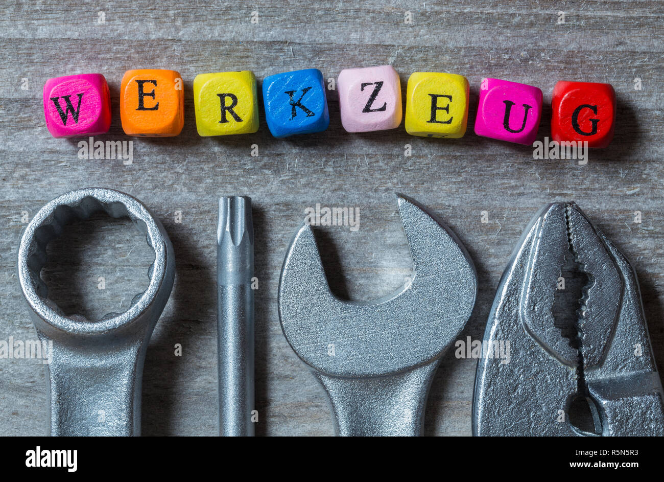 tool letter cube and tool on gray wood. visualization Stock Photo - Alamy