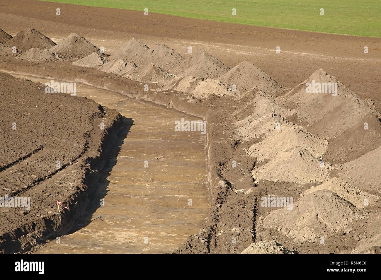 Trench digged on a land Stock Photo - Alamy