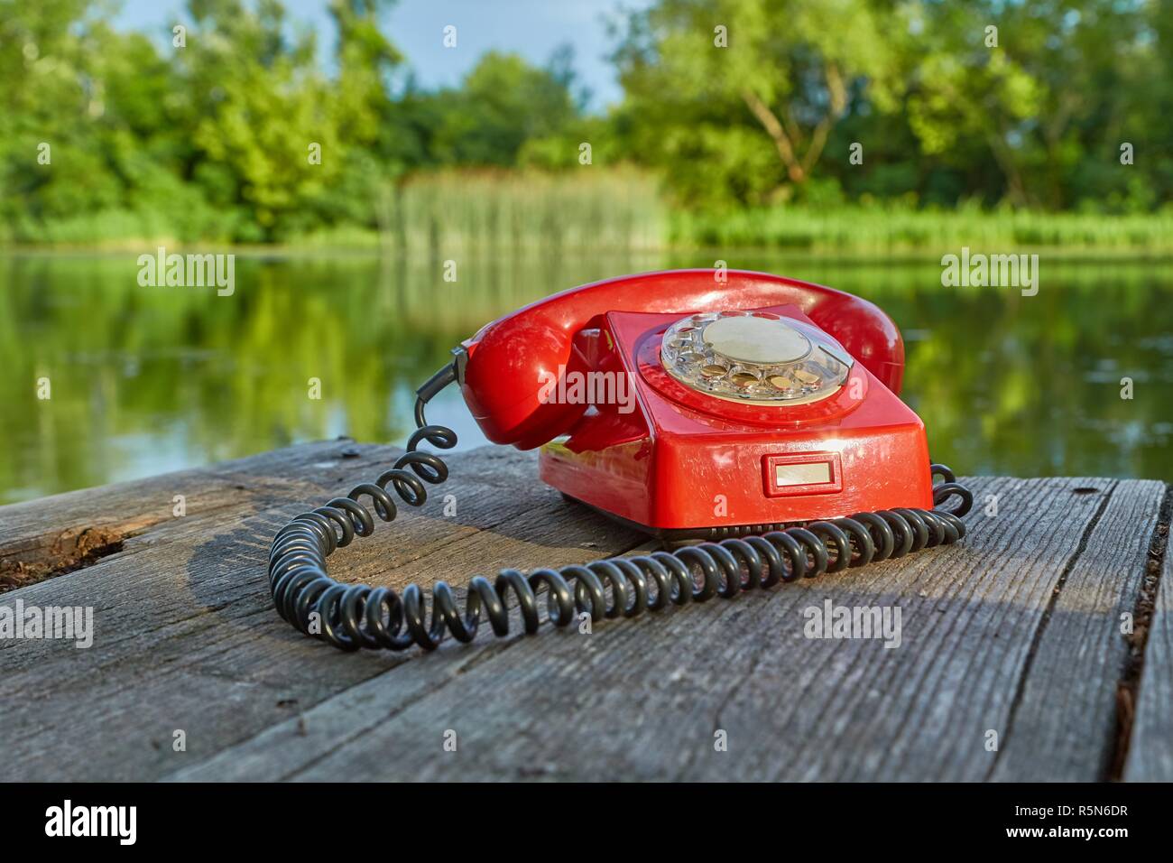 Old telephone in nature Stock Photo - Alamy