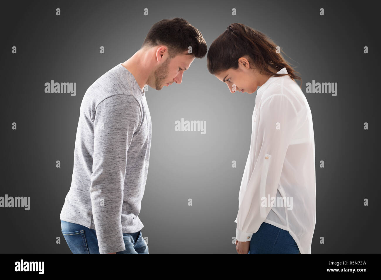 Sad Couple Standing Face To Face Stock Photo - Alamy