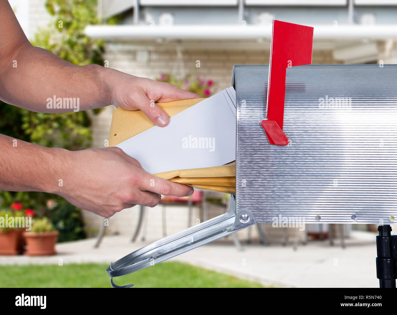 Man opening mailbox hi-res stock photography and images - Alamy