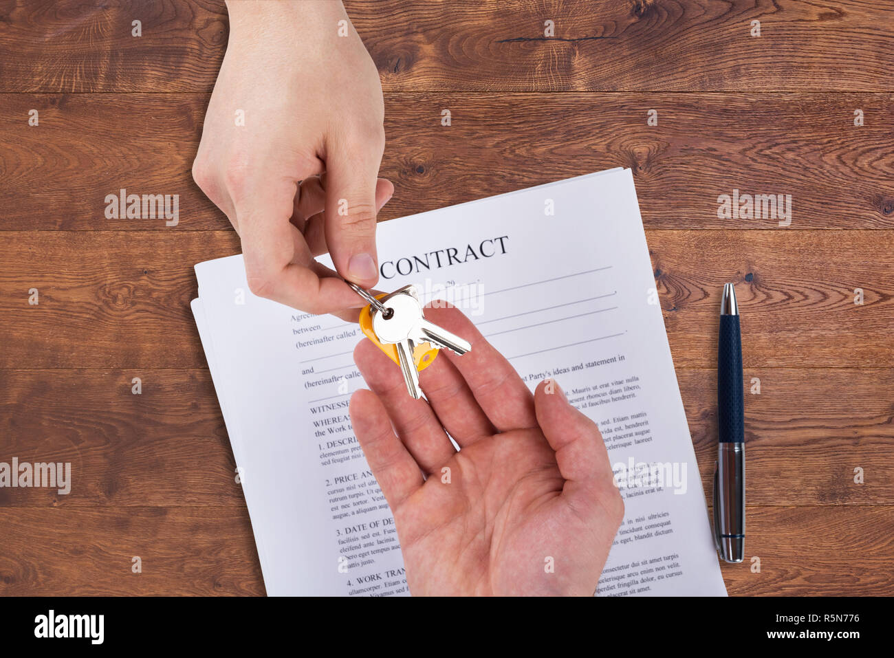 Real Estate Agent Giving Home Keys To Client Stock Photo - Alamy