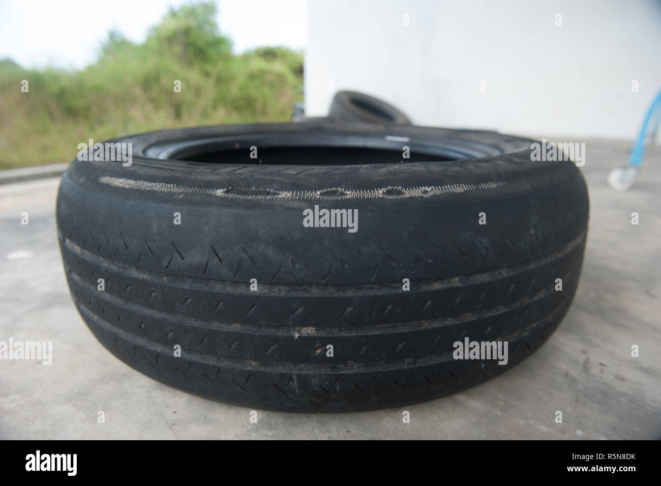 Used old tyre Stock Photo - Alamy