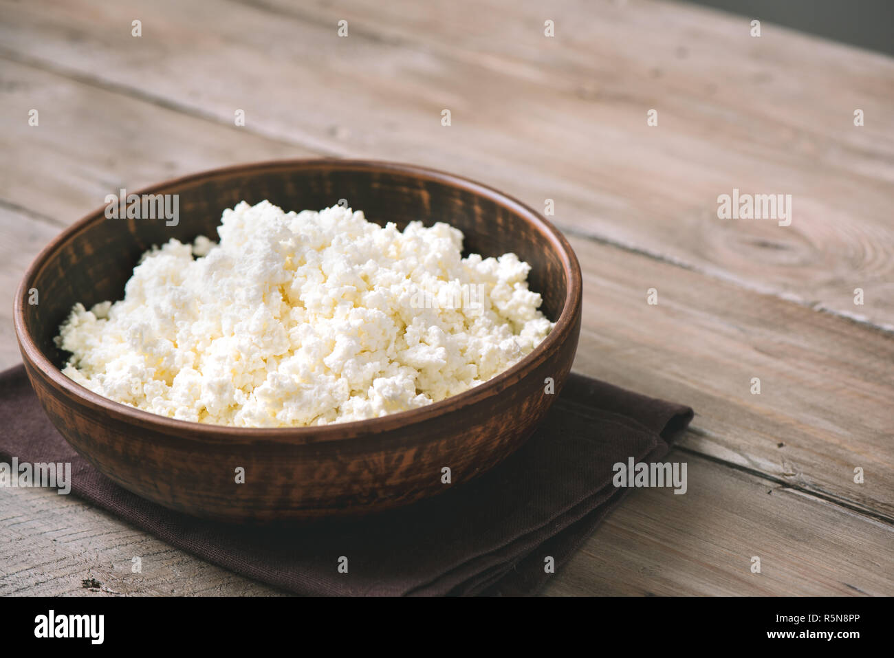 Organic Farming Cottage cheese on rustic wooden background, copy space ...
