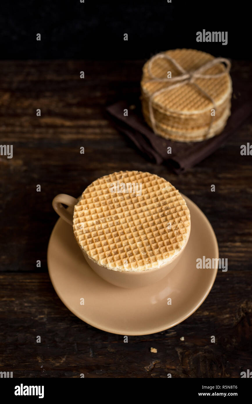 Dutch waffles, stroopwafel with caramel and hot drink. Traditional ...