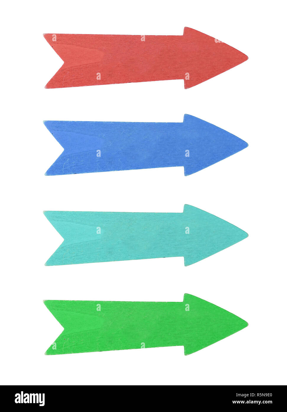 Four wooden painted direction arrows isolated Stock Photo - Alamy
