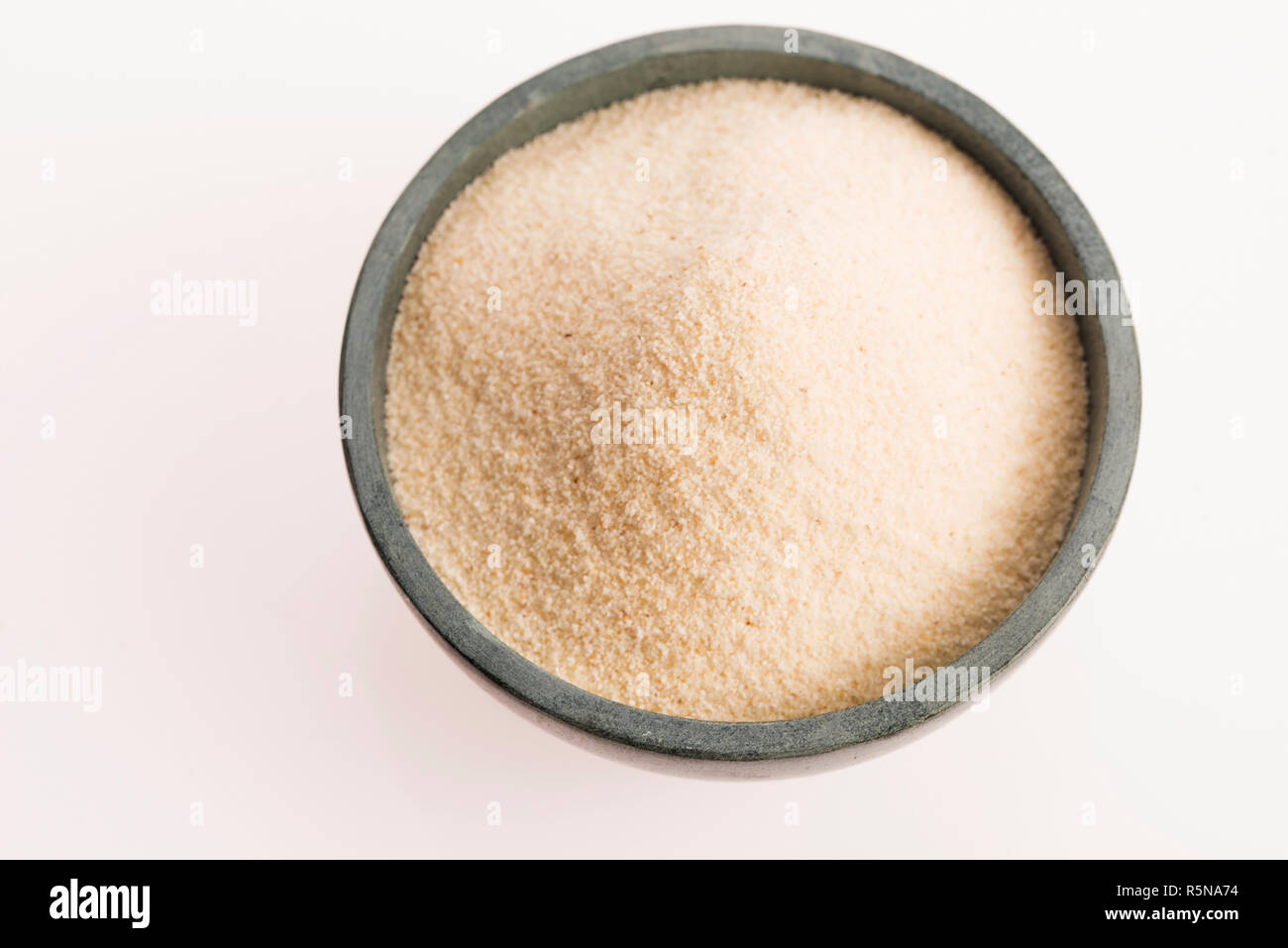 bowl of semolina isolated on white Stock Photo - Alamy
