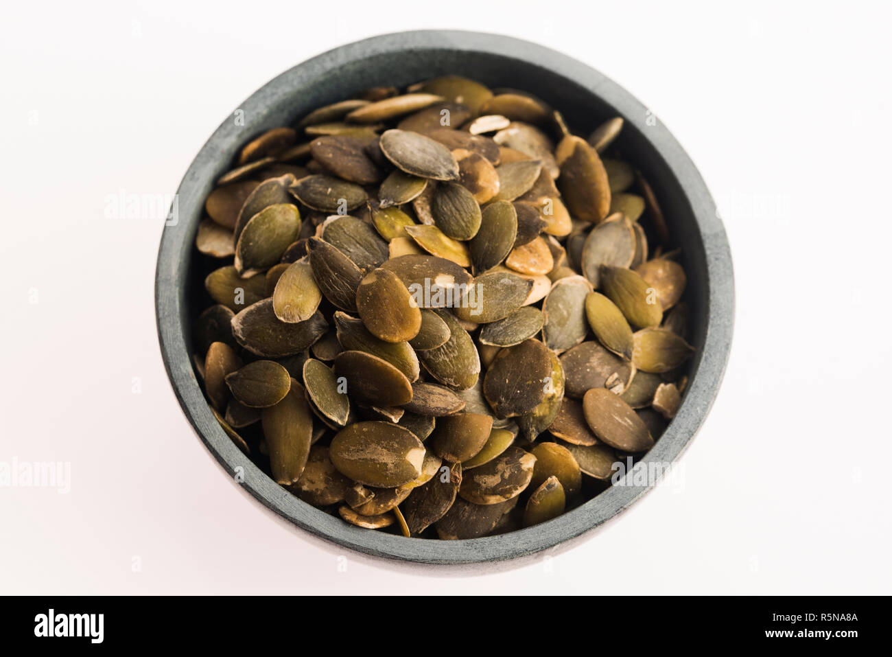 pumpkin seeds isolated on white background Stock Photo - Alamy