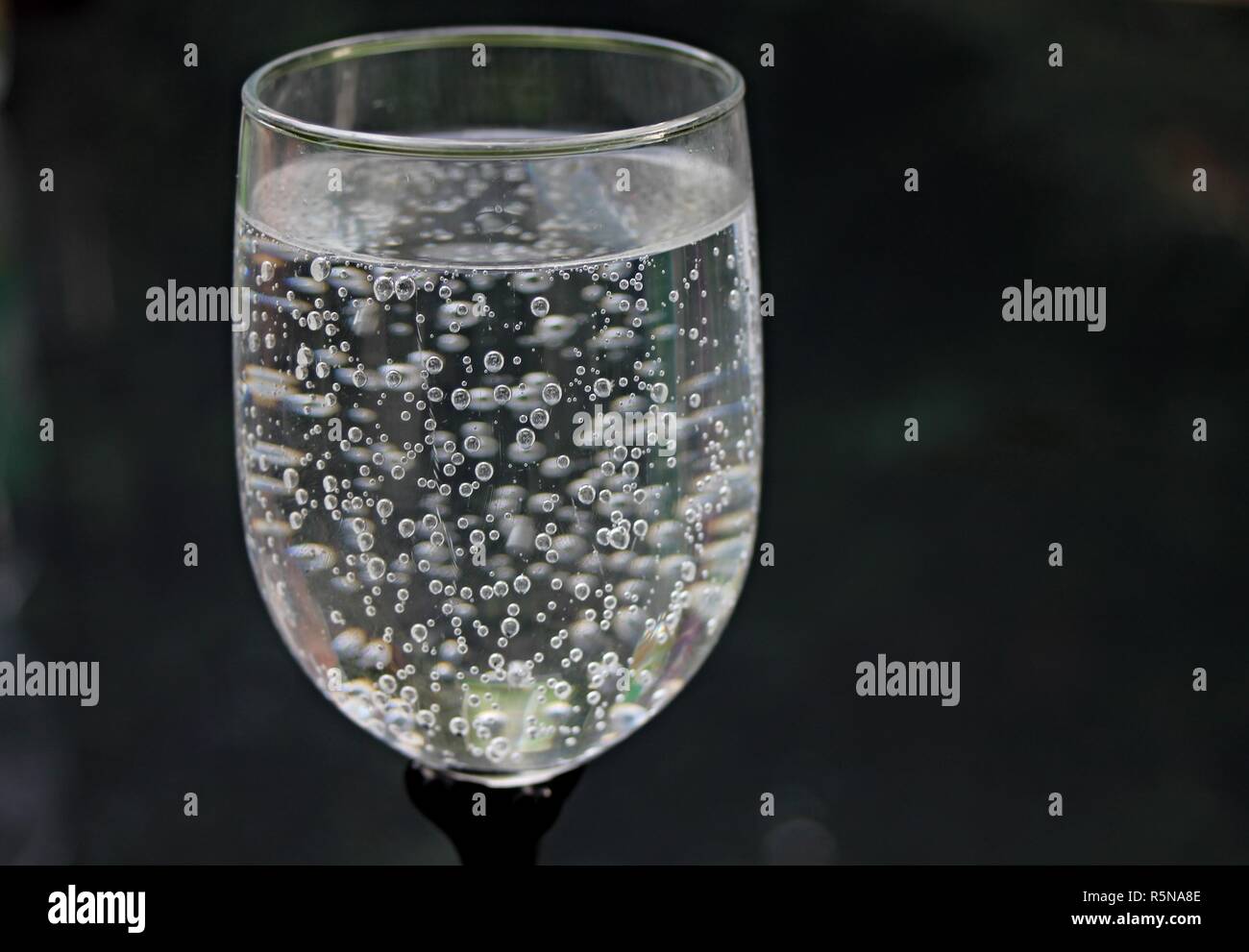 water bubbles in the glass of water Stock Photo - Alamy