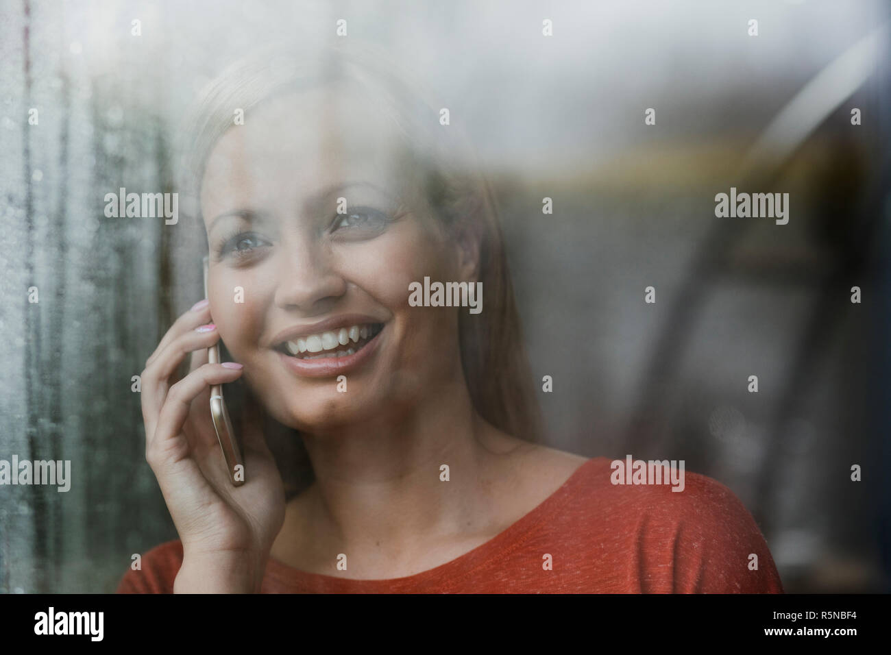 Enjoying A Phone Call At Home Stock Photo - Alamy
