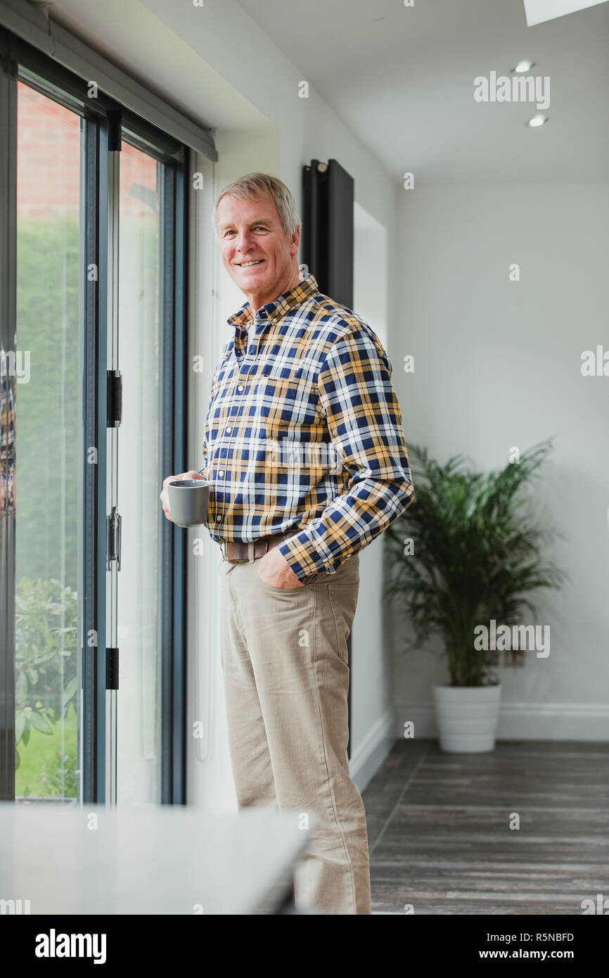 Happy Senior Man At Home Stock Photo - Alamy