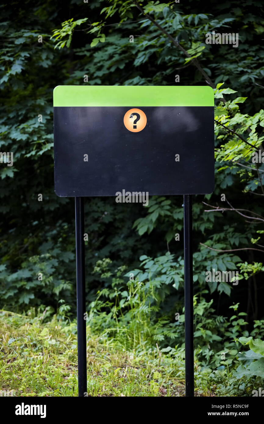 Empty black and green metal sign board with a question mark symbol in ...