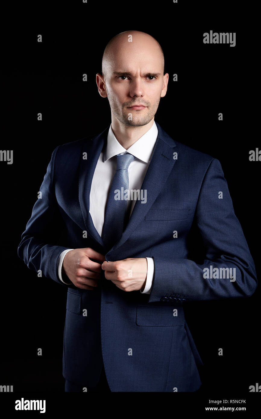 Man Fastens his Jacket Stock Photo - Alamy