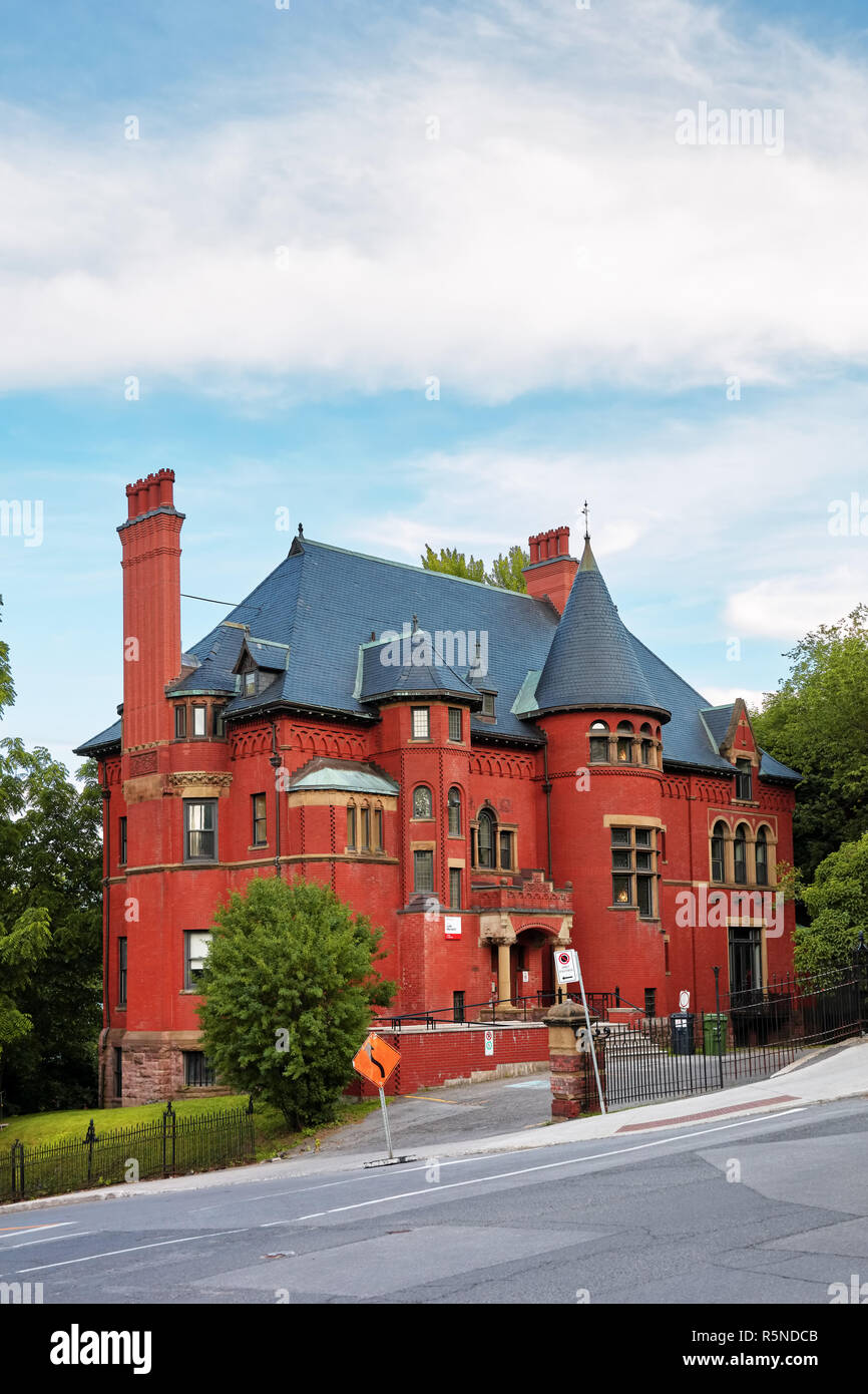 Old historical Victorian building with red brick walls in Montreal ...