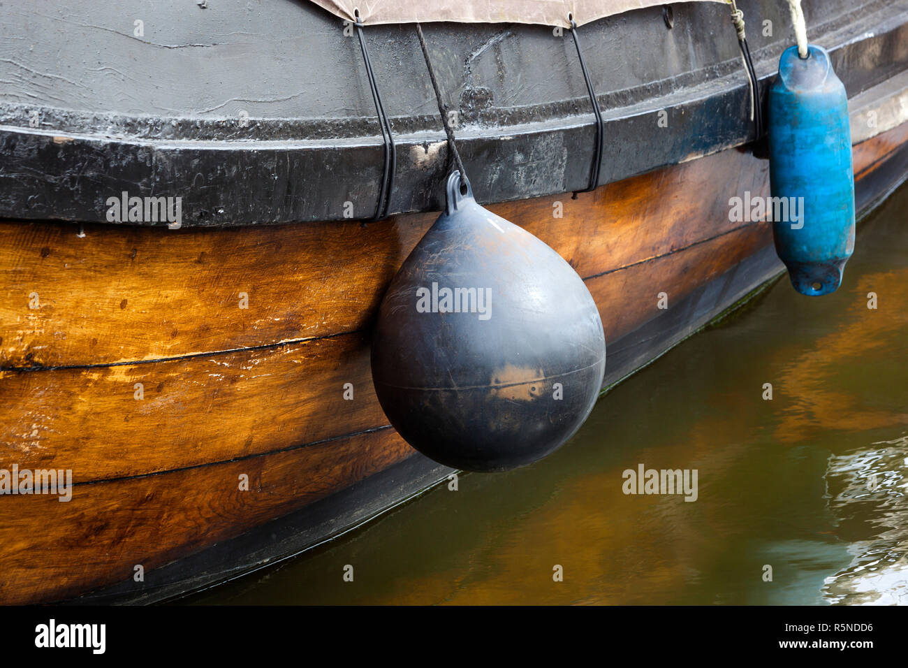 Fenders on a traditional wooden ship Stock Photo - Alamy