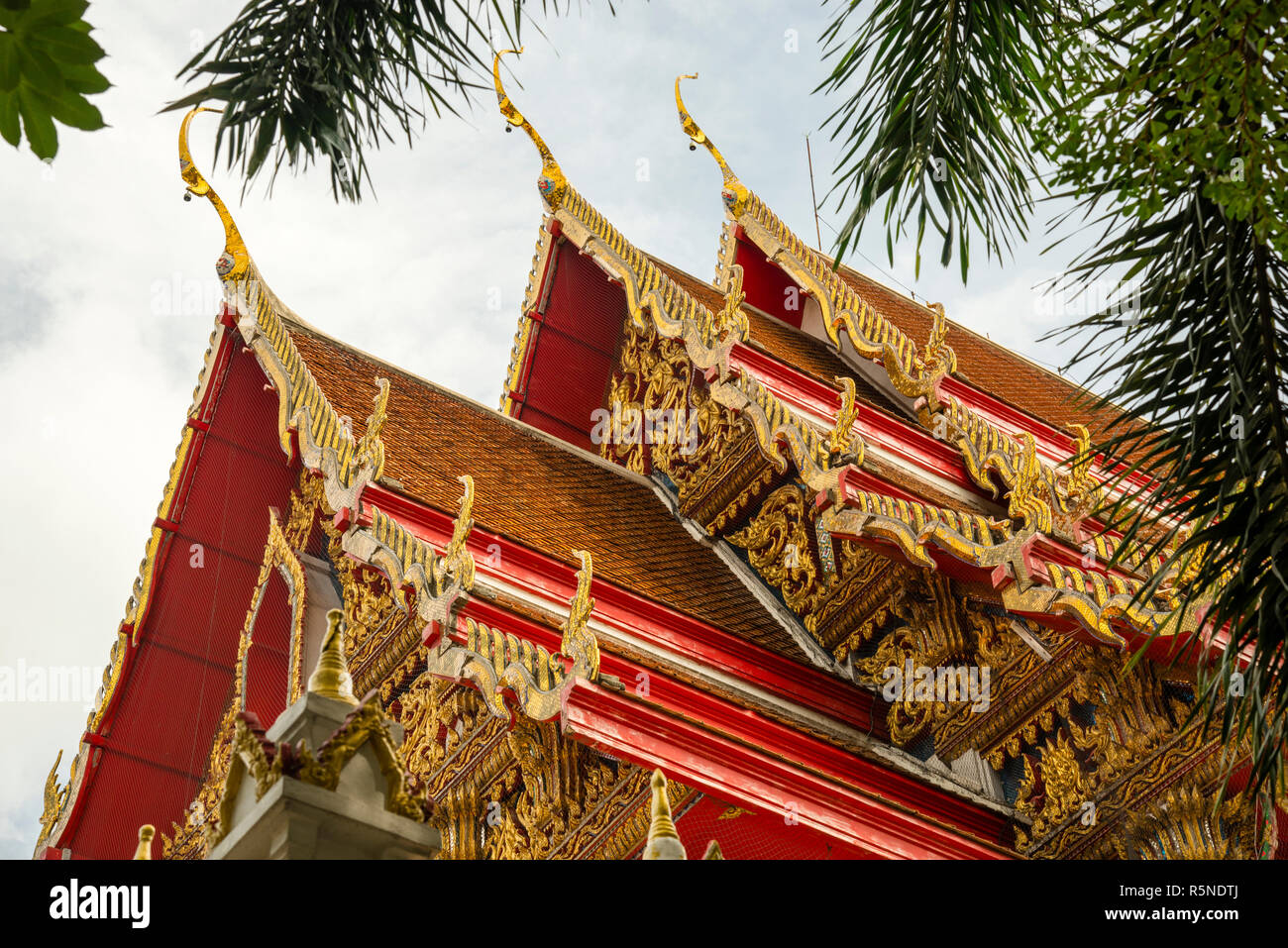 Thai architecture in Bangkok, Thailand sweeping multi-tiered and richly ...
