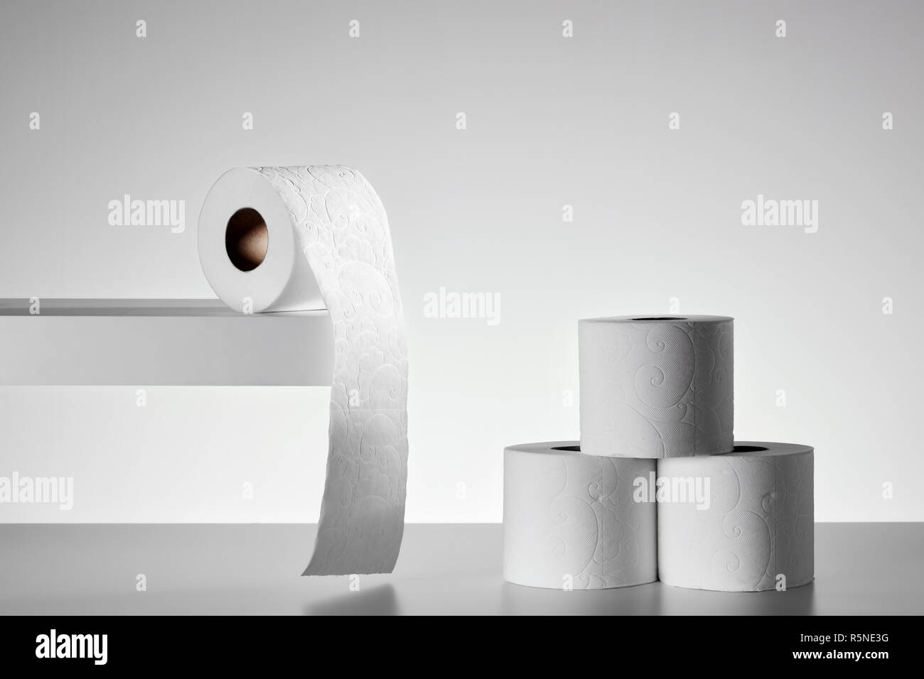 Roll of soft white toilet papers on white background. Elegant studio ...