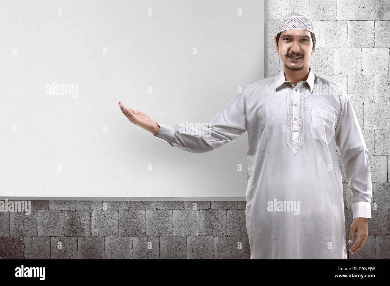 Asian muslim man pointing finger hi-res stock photography and images ...