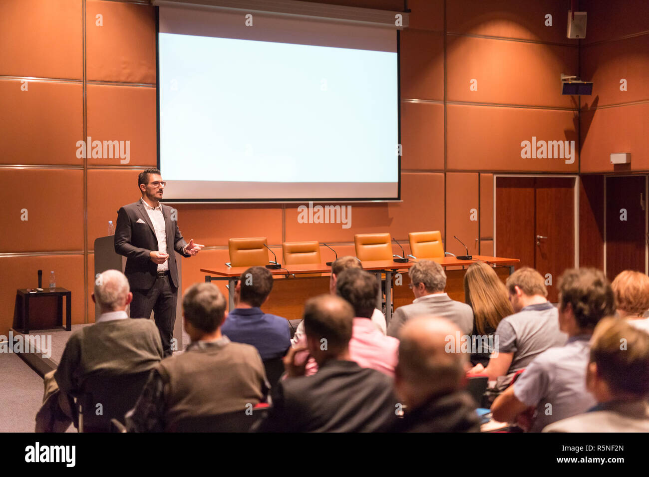 Business speaker giving a talk at business conference event Stock Photo ...