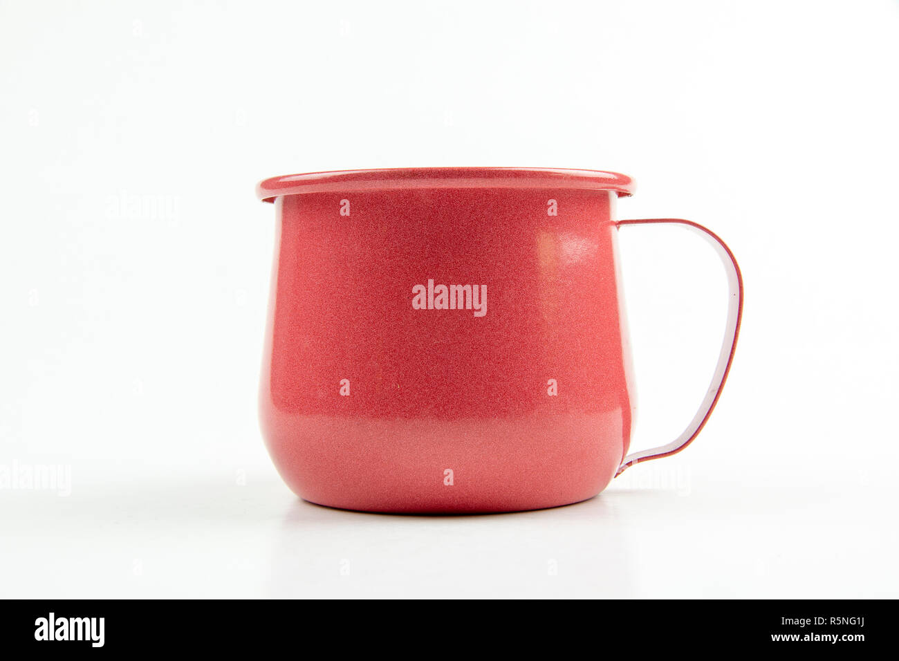 Red tin cup on white background Stock Photo - Alamy