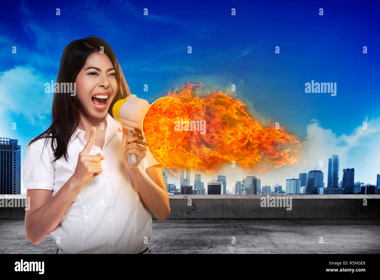 Asian Woman Shouting Megaphone On Fire Stock Photo - Alamy