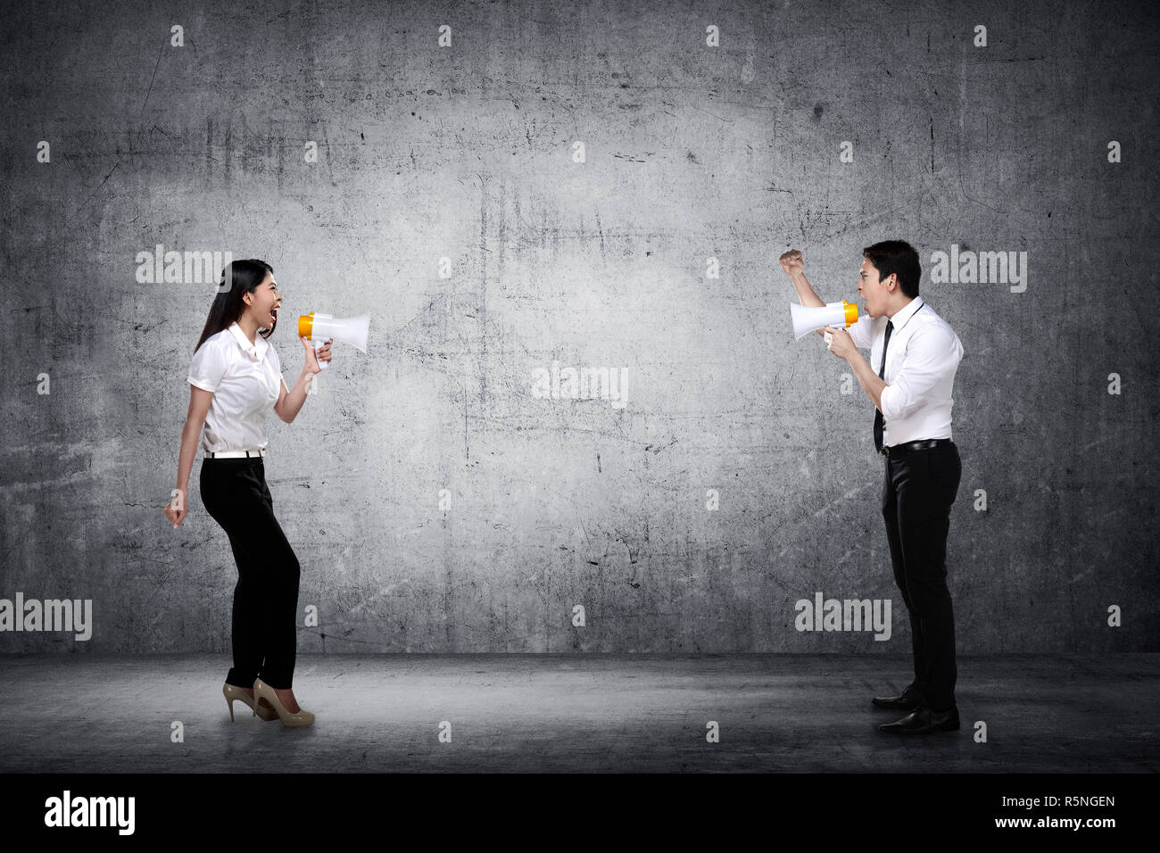 Asian business man and woman shout each other Stock Photo - Alamy