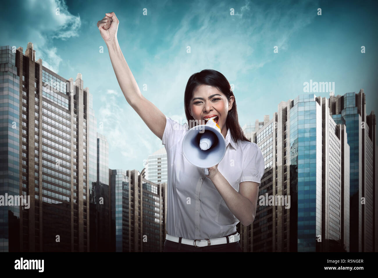 Business woman using megaphone Stock Photo - Alamy