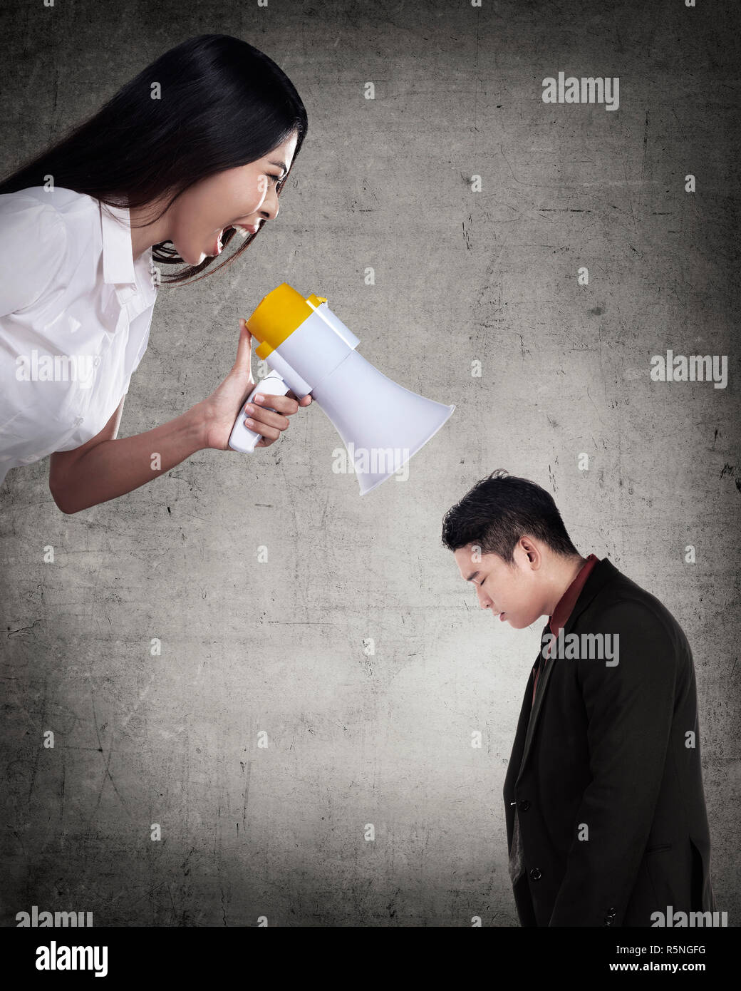 Business leader give order via megaphone to subordinate Stock Photo - Alamy