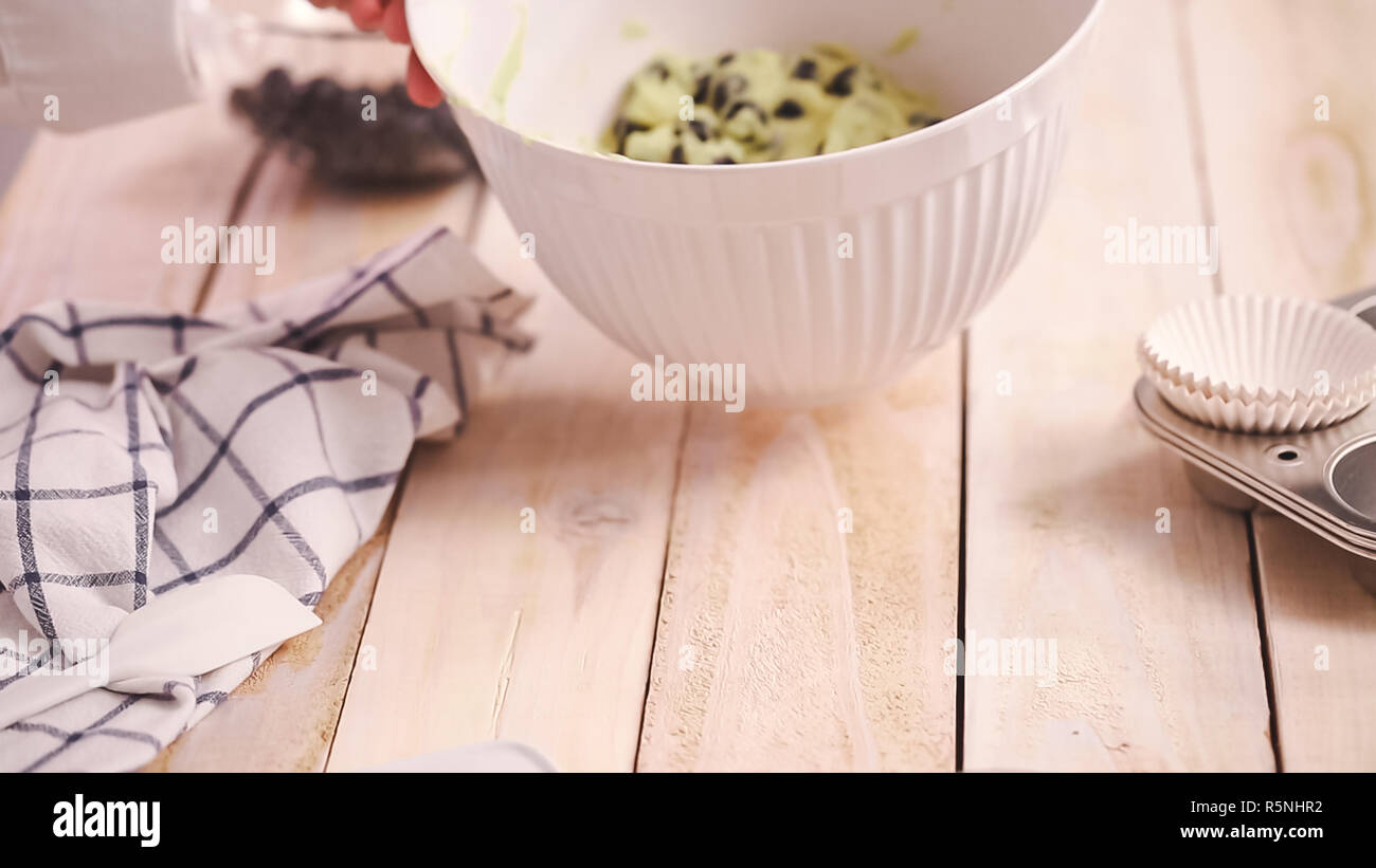 Mixing ingredients together in mixing bowl for blueberry muffins Stock ...