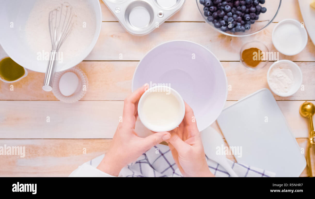 Mixing ingredients together in mixing bowl for blueberry muffins Stock ...
