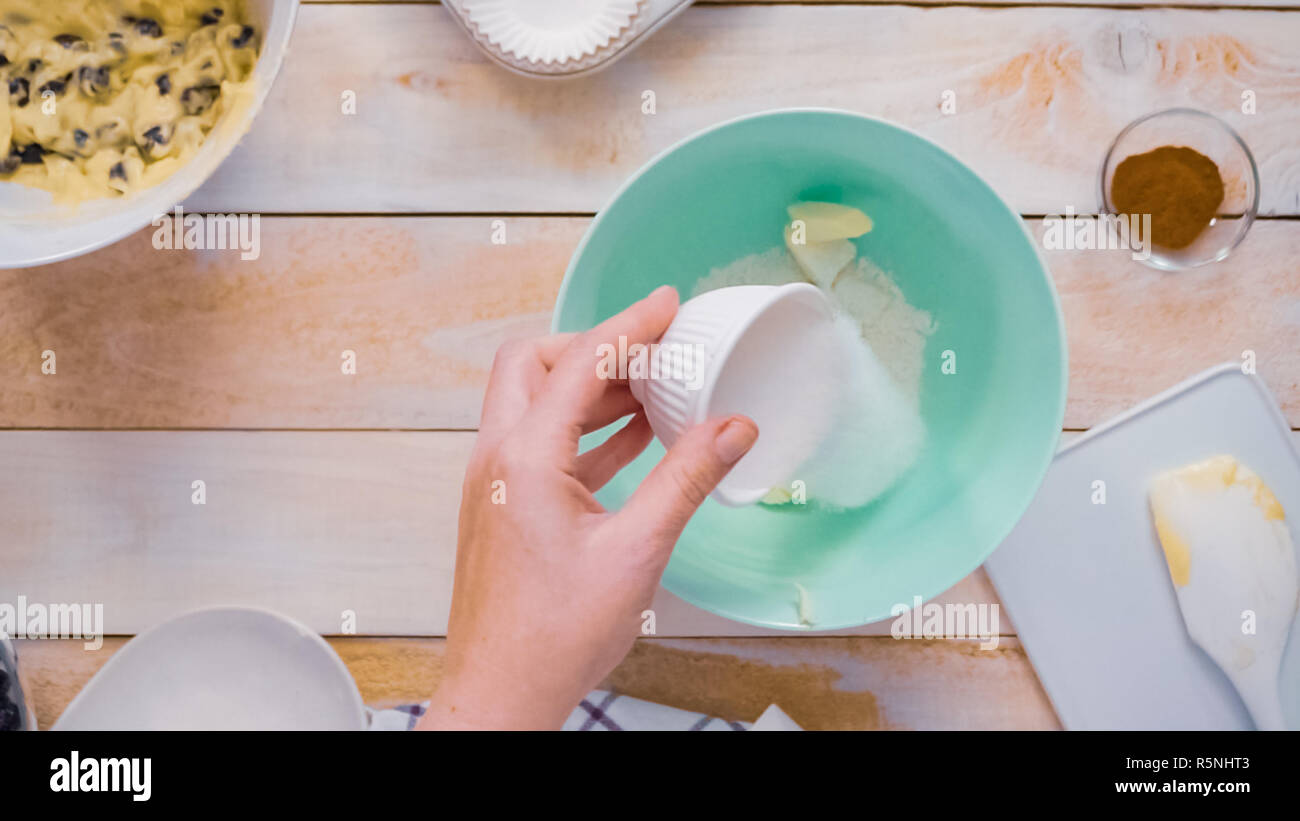 Mixing ingredients together in mixing bowl for blueberry muffins Stock ...