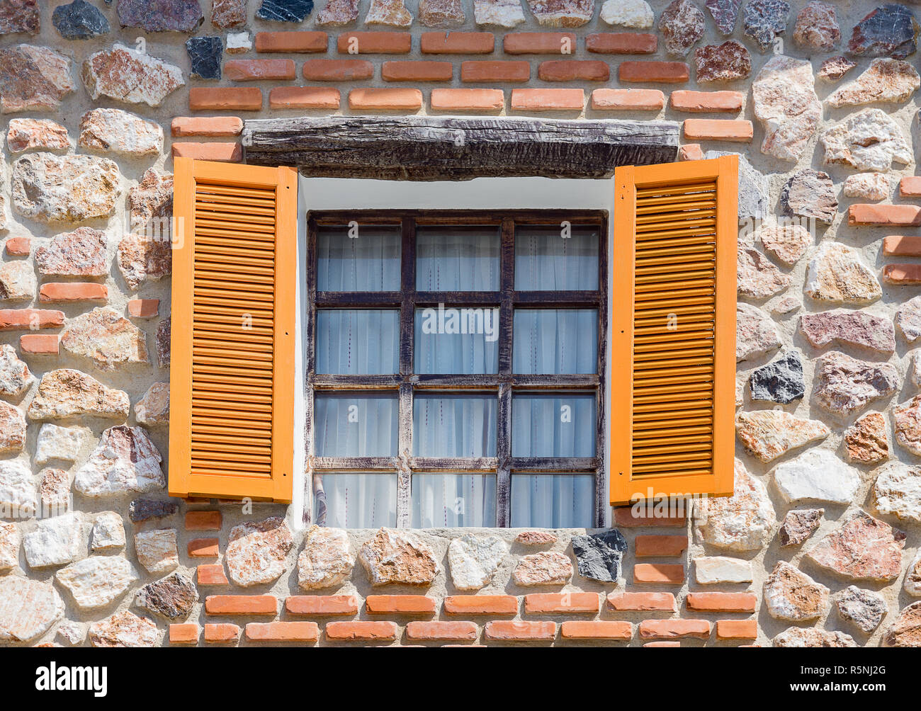 Opening windows from the house made from rocks Stock Photo - Alamy
