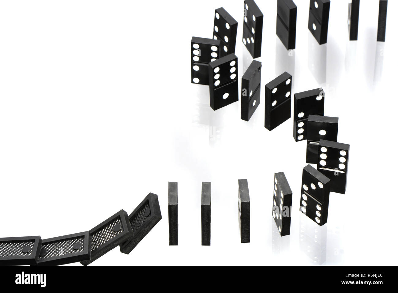 A stack of dominoes falling on white background with copy space Stock ...