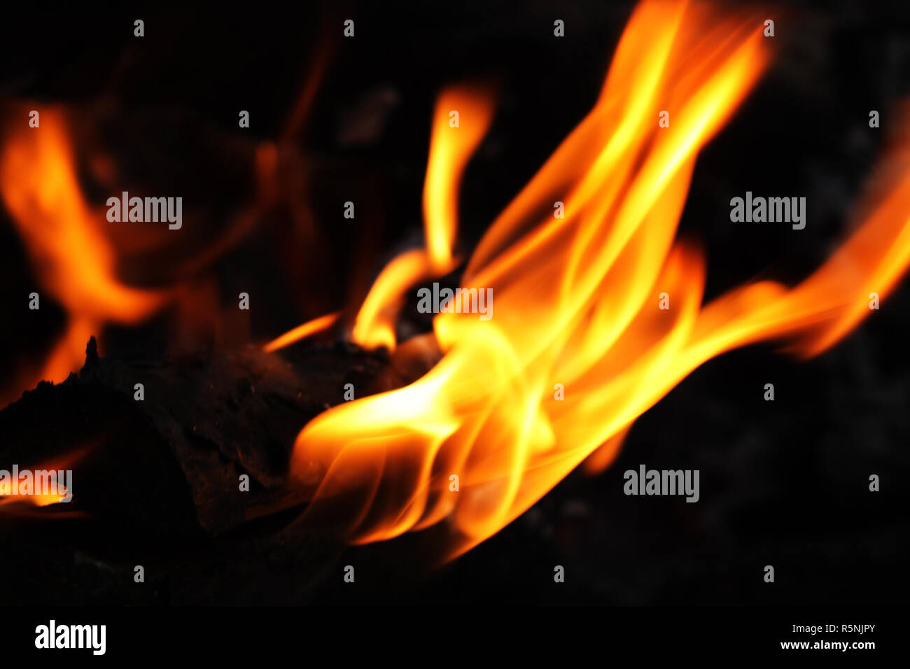 Background with single flame on dark Stock Photo - Alamy