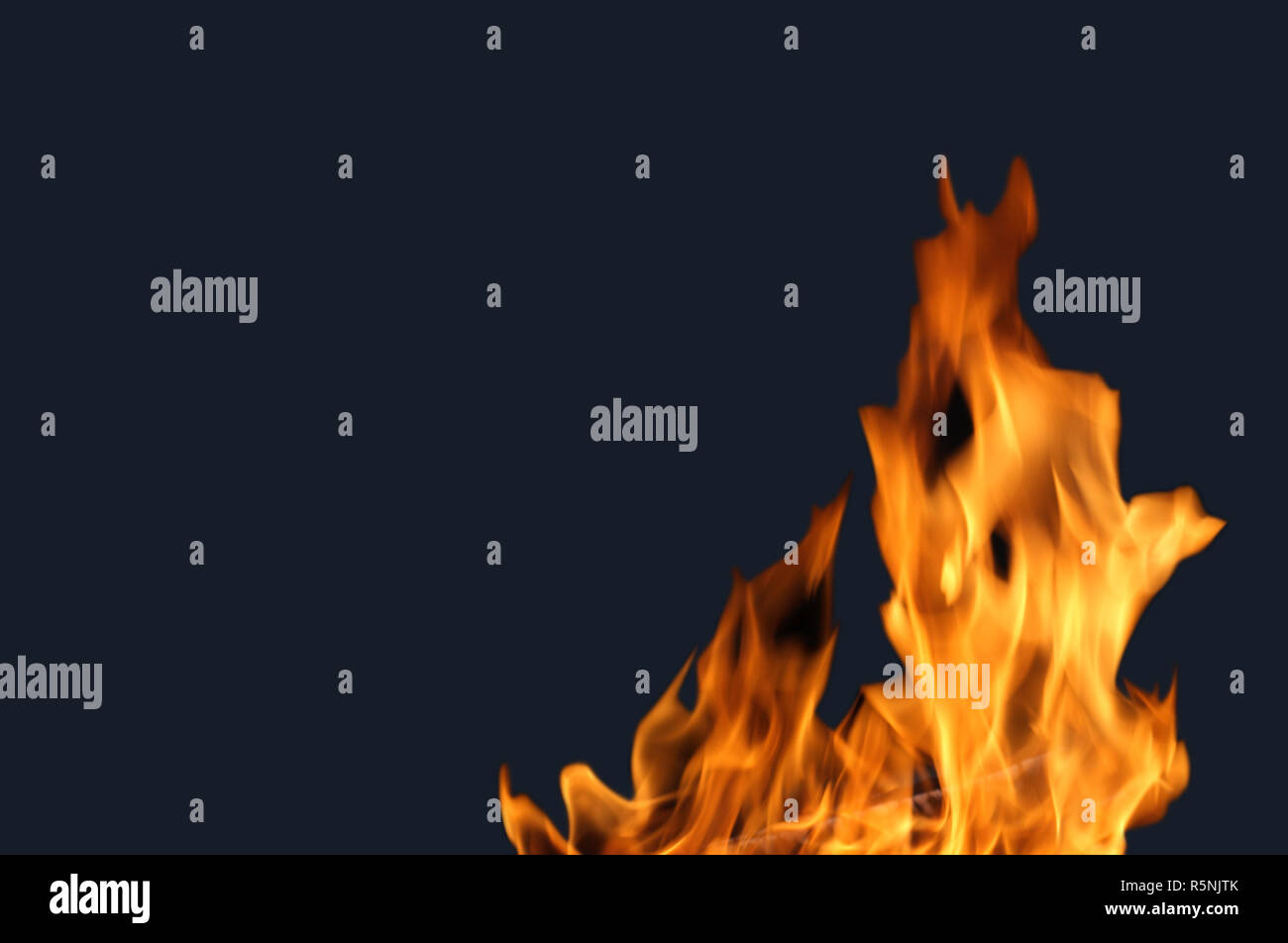Single fire flame isolated on black background with copy space Stock ...