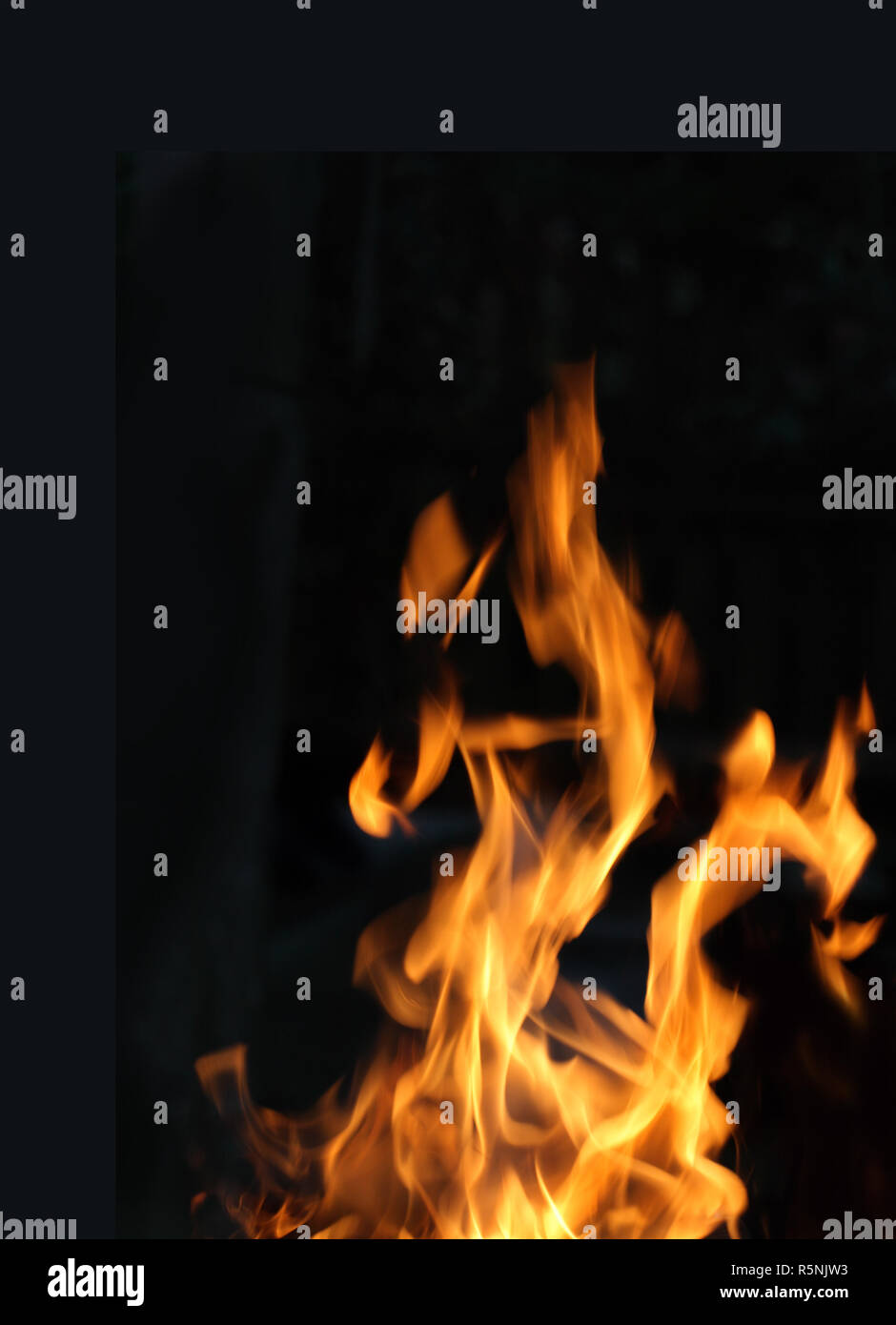 Single fire flame isolated on black background with copy space Stock ...