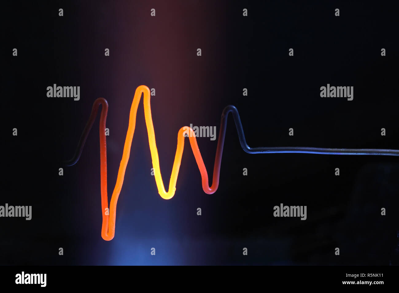 Scorching diagram made from brass wire on dark background with copy ...