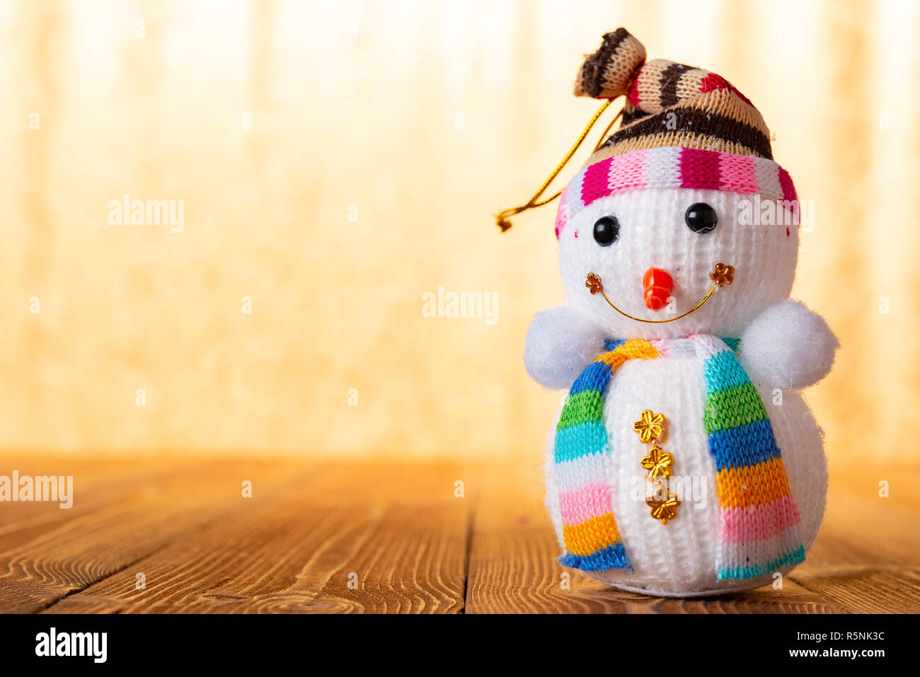 snowman in front of a bright golden background Stock Photo - Alamy