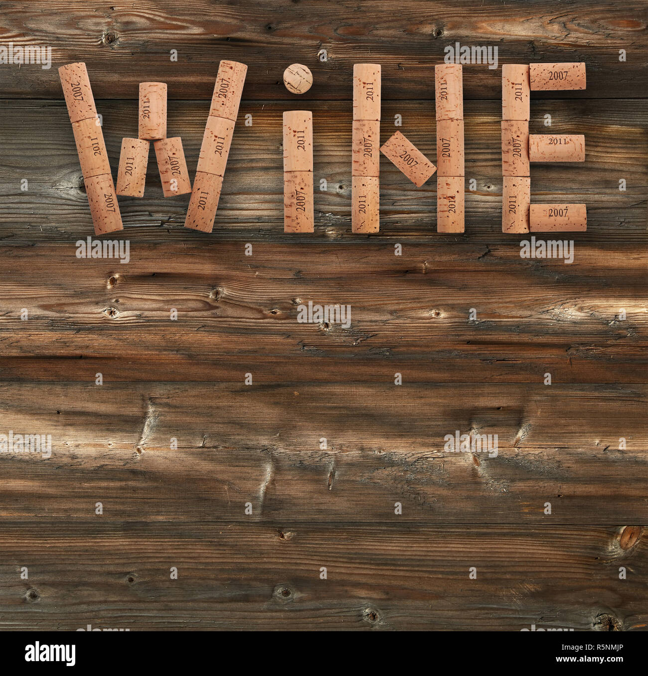 Word wine shaped by corks over dark vintage wood Stock Photo - Alamy