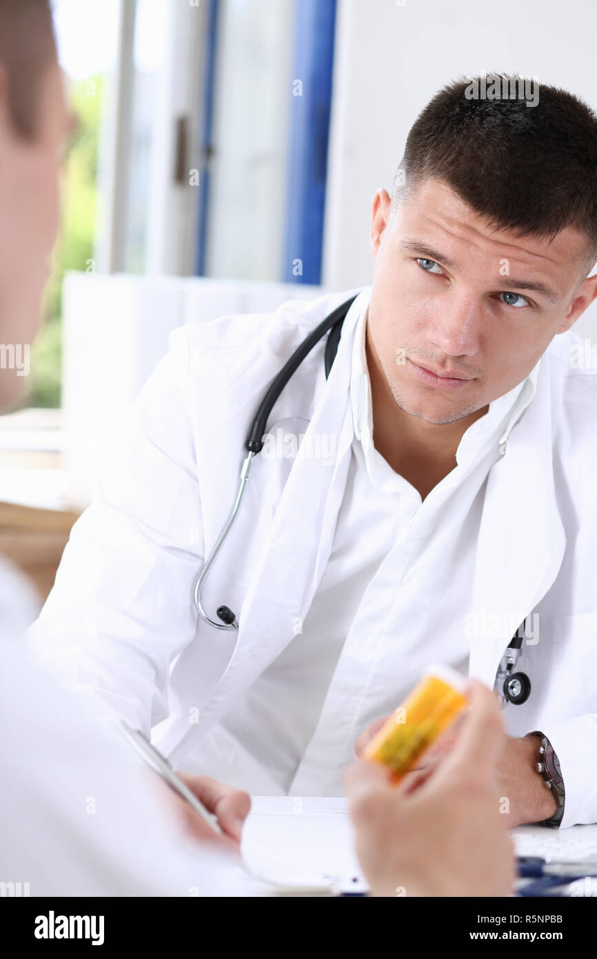Male medicine doctor write prescription Stock Photo - Alamy