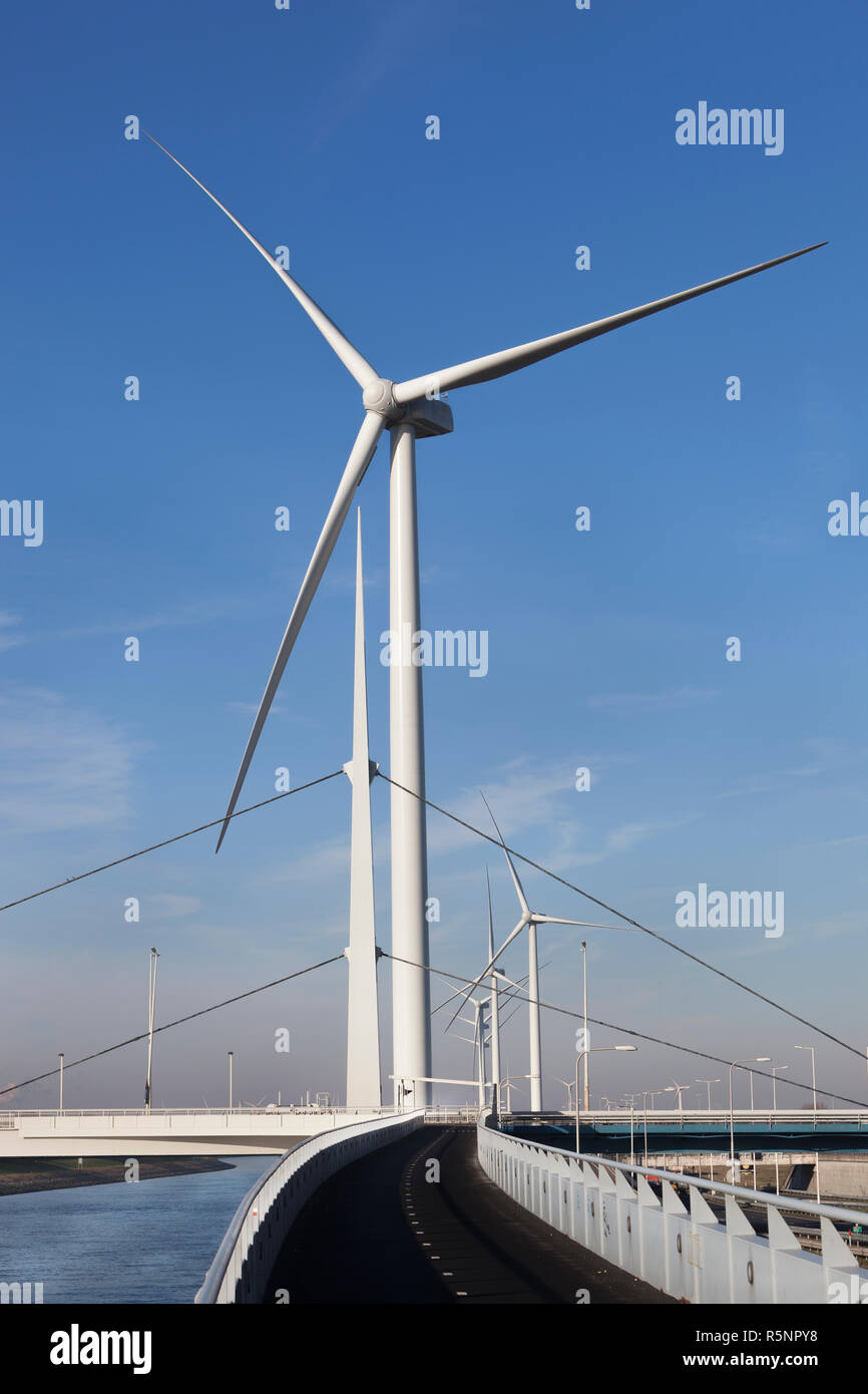 Wind turbines and an asphalted bicycle path Stock Photo - Alamy
