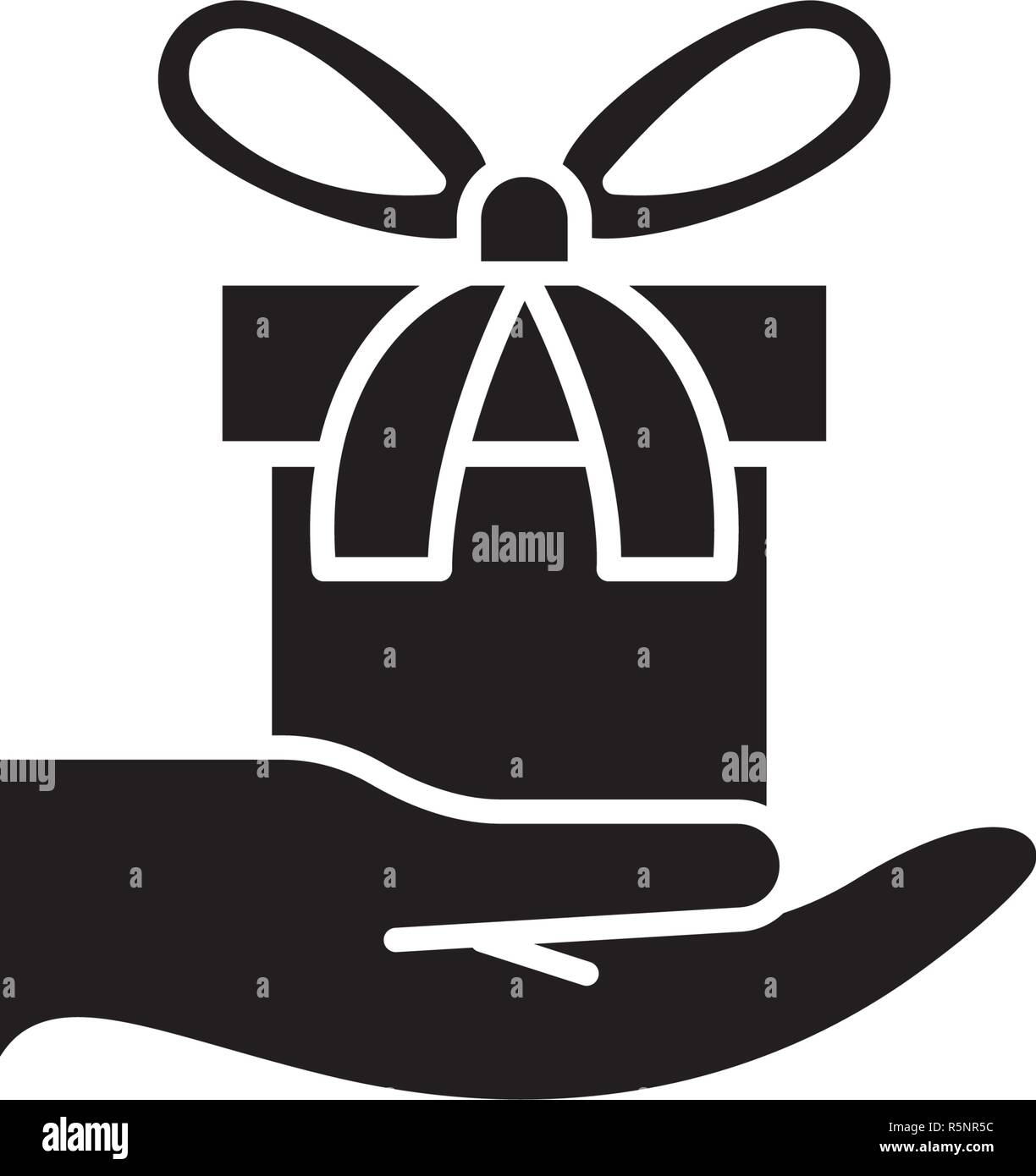 Gift in hand black icon, vector sign on isolated background. Gift in ...