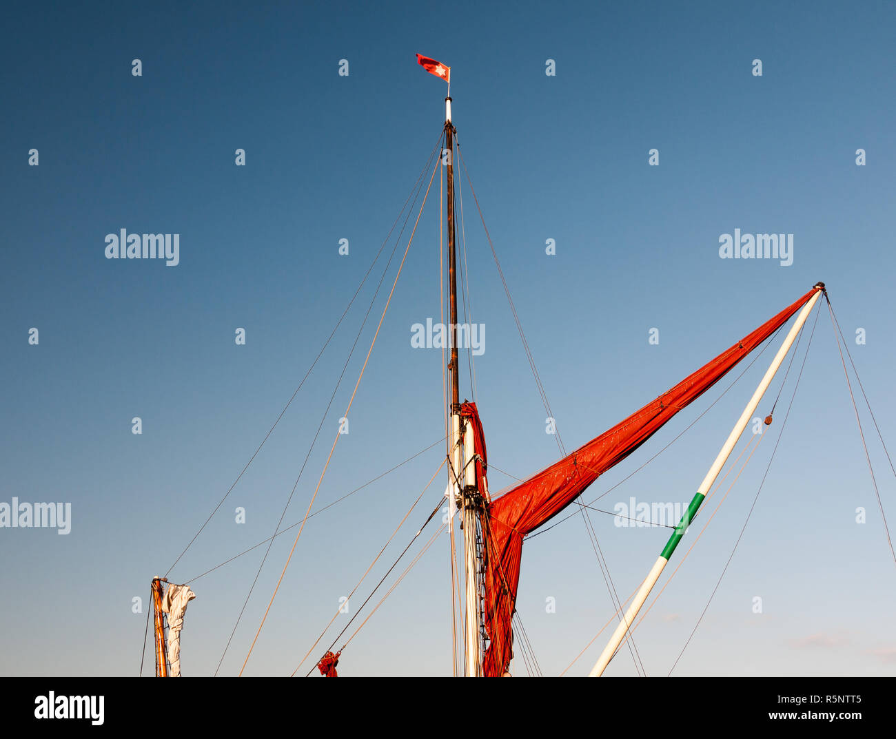 a high up mast in blue sky of london barge black water maldon essex ...